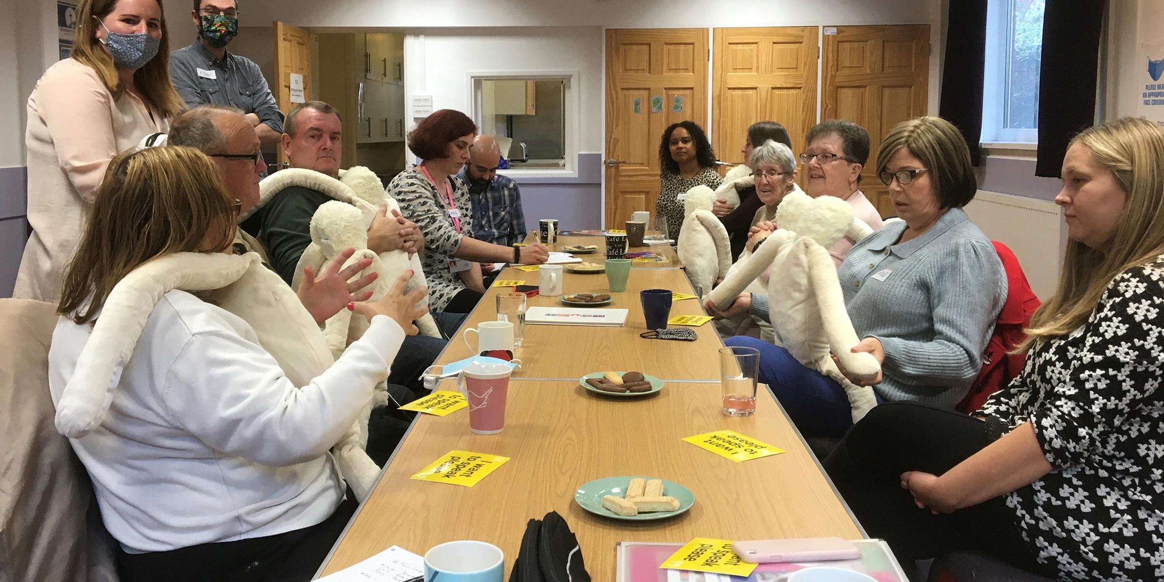 People affected by dementia try out HUG – a soft, comforting cuddle ...