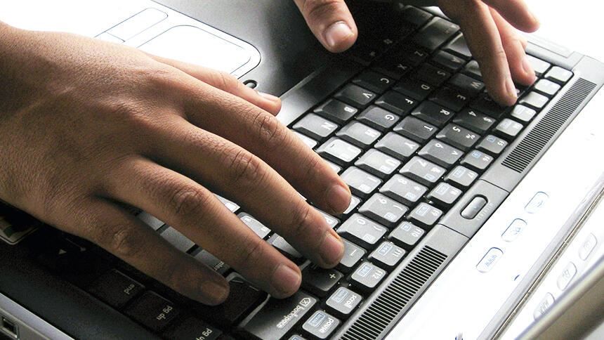 Someone using a computer keyboard | Alzheimer's Society